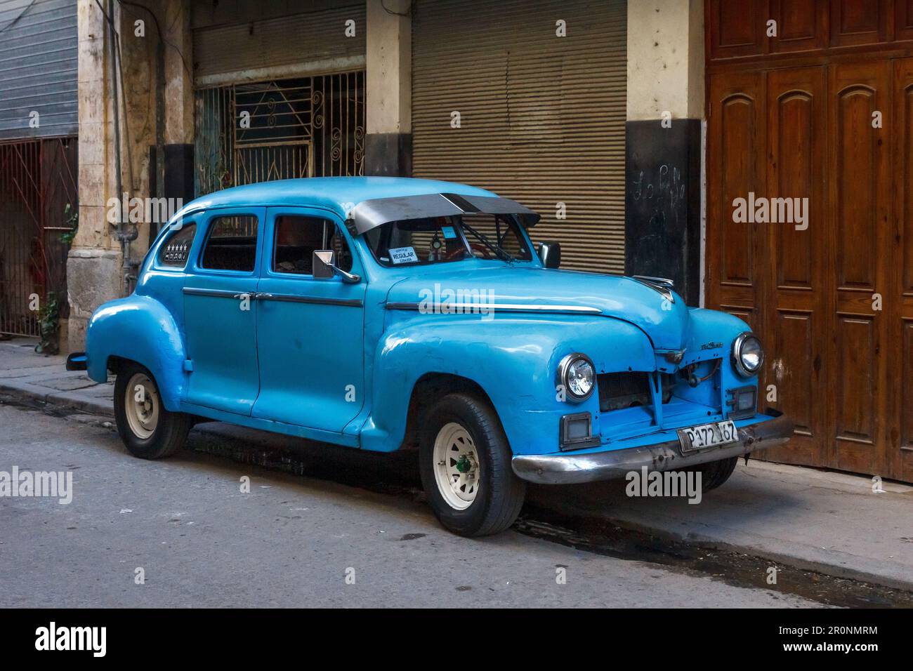 Havana, Cuba - April 26, 2023: An old American car is parked on the ...