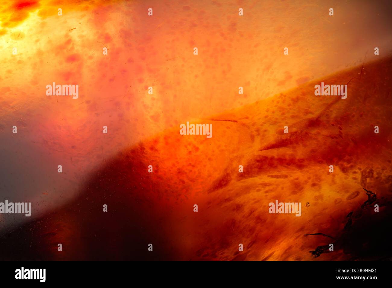 Amber macro detail. Red yellow orange texture background. close-up raw ...