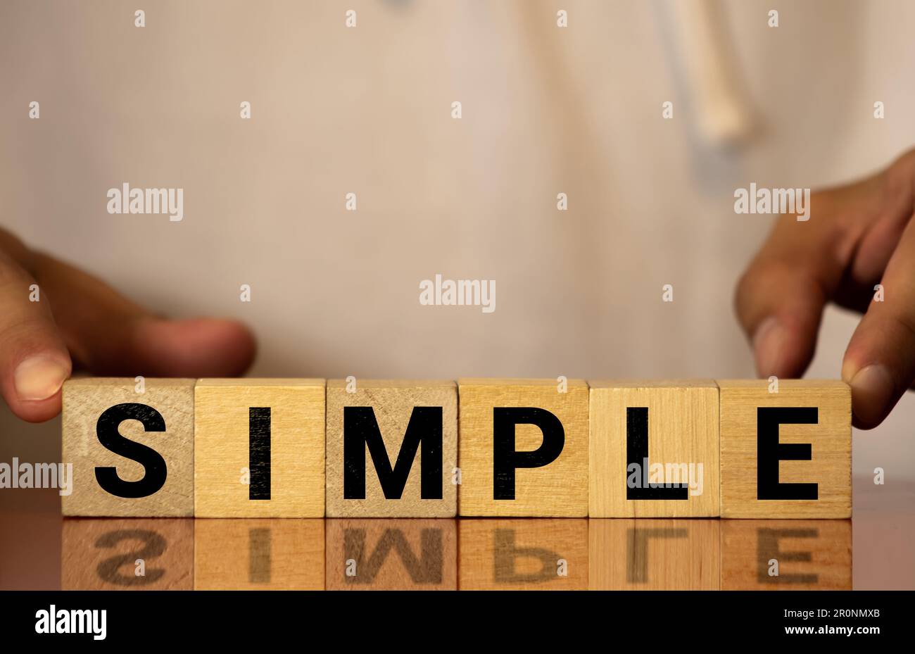 SIMPLE word made with building blocks isolated on white Stock Photo - Alamy