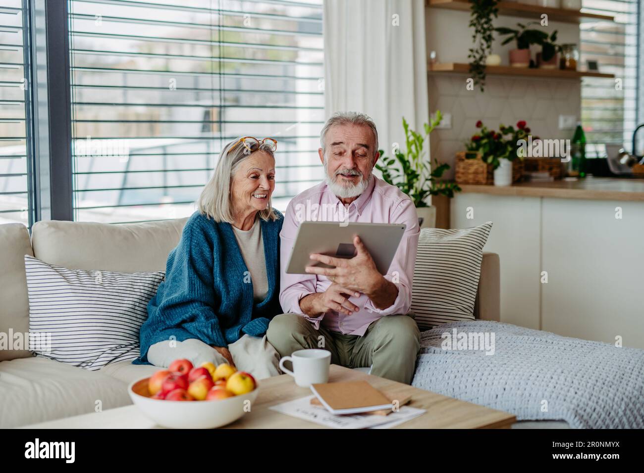 Senior woman scrolling online indoors hi-res stock photography and ...