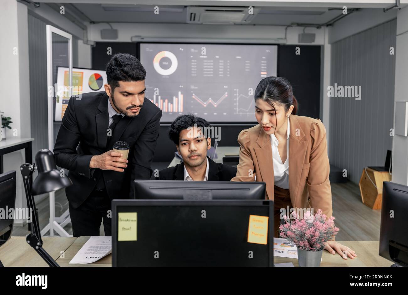 Financial advisors collaborate to assess a company's financial ...