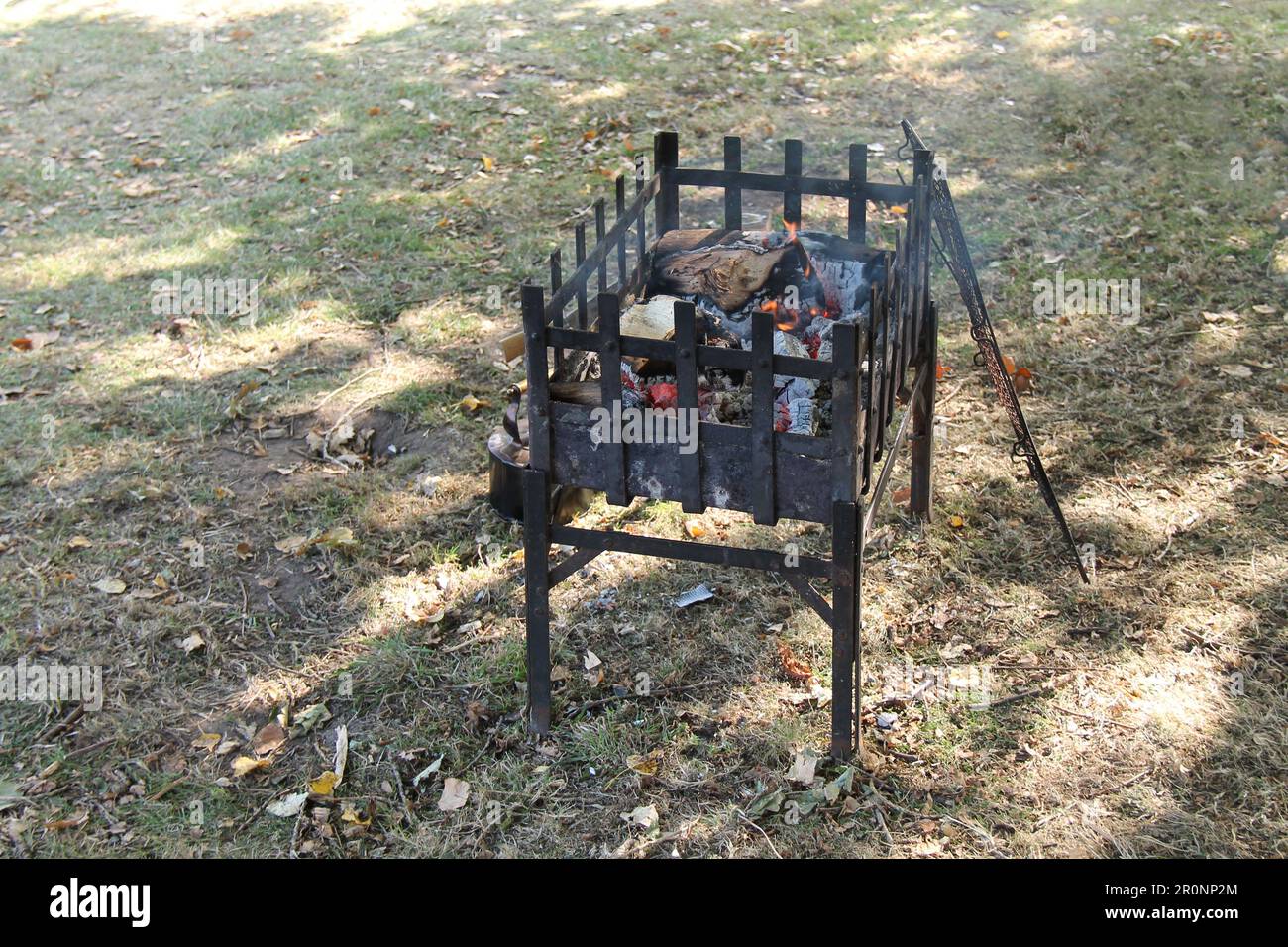 A Metal Framed Outdoor Log Wood Cooking Fire Stock Photo - Alamy