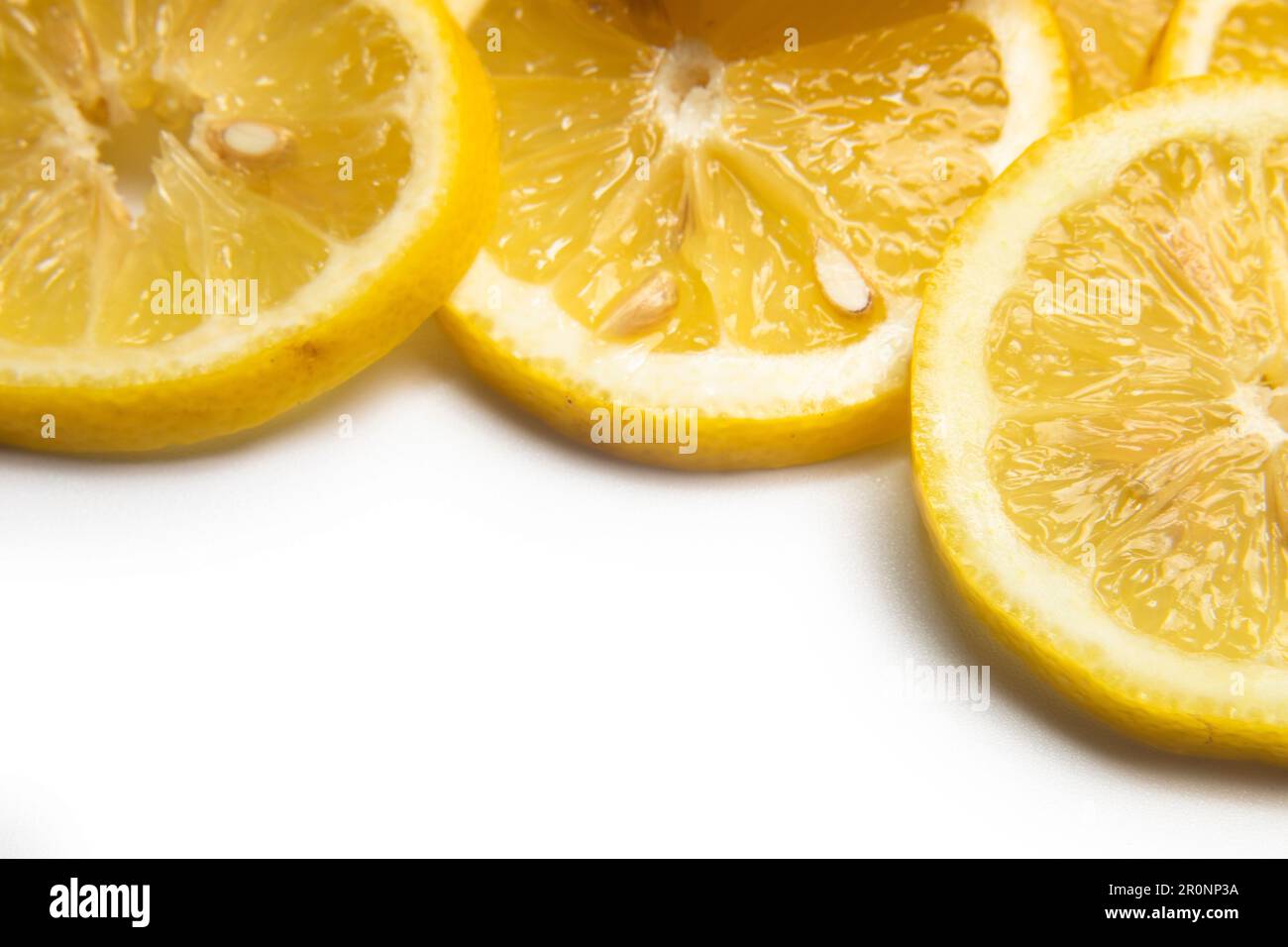 vertical overlapping lemon slices footer on white background with copy space Stock Photo - Alamy