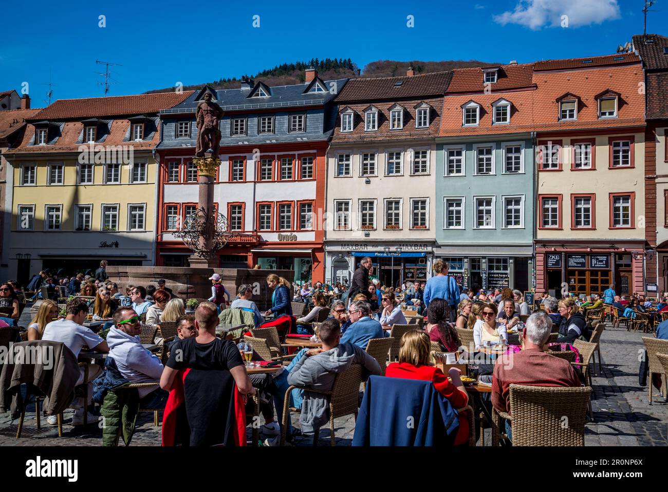 Cafes full of people at the Marktplatz, a central square in the old ...