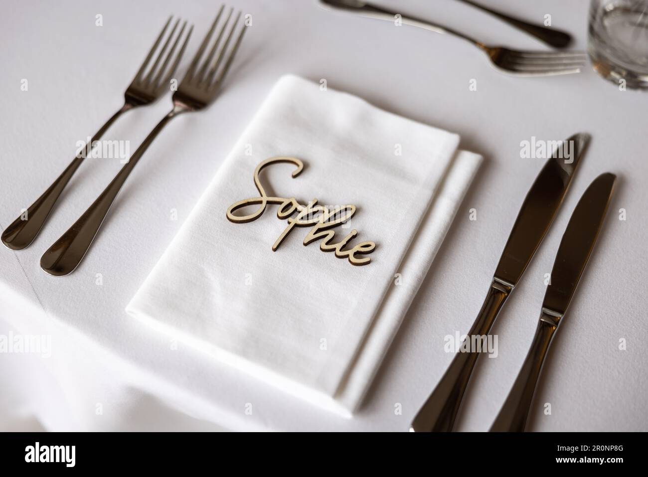 Table places with wooden name place cards Sophie Stock Photo - Alamy