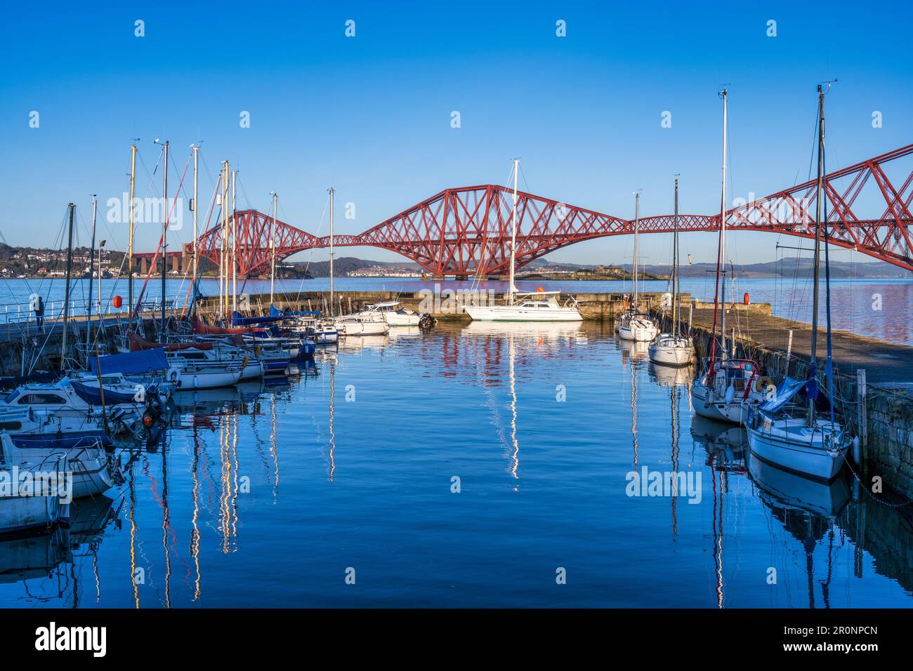 Yachts moored in South Queensferry harbour with backdrop of Forth Rail ...