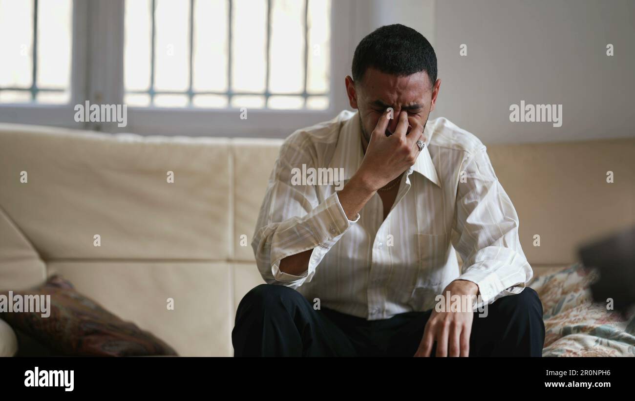 Dramatic young man feeling distraught and stressed from emotional ...