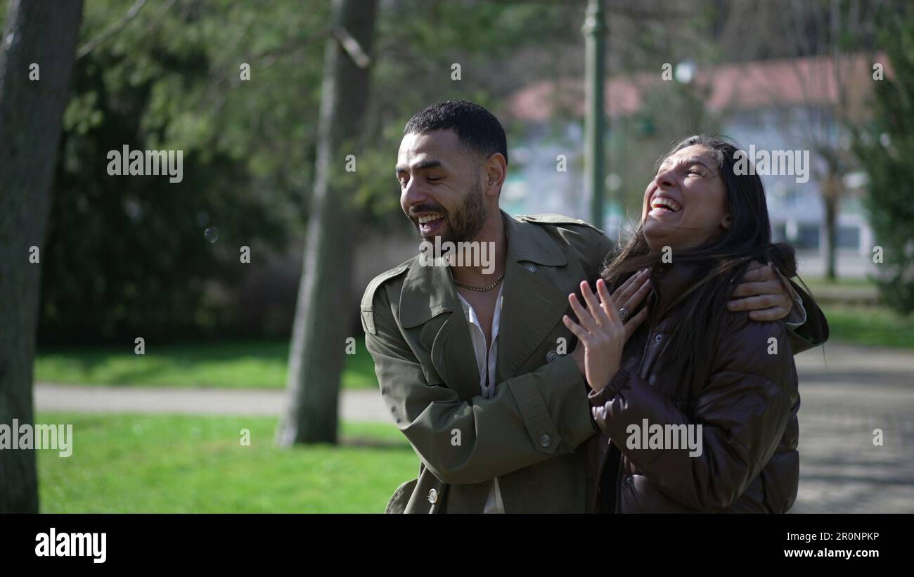 Happy Arab Couple Enjoying Sunny Stroll at Park with Genuine Laughter ...