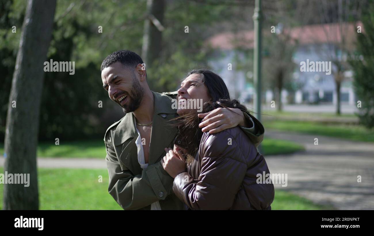 Happy Arab Couple Enjoying Sunny Stroll at Park with Genuine Laughter ...