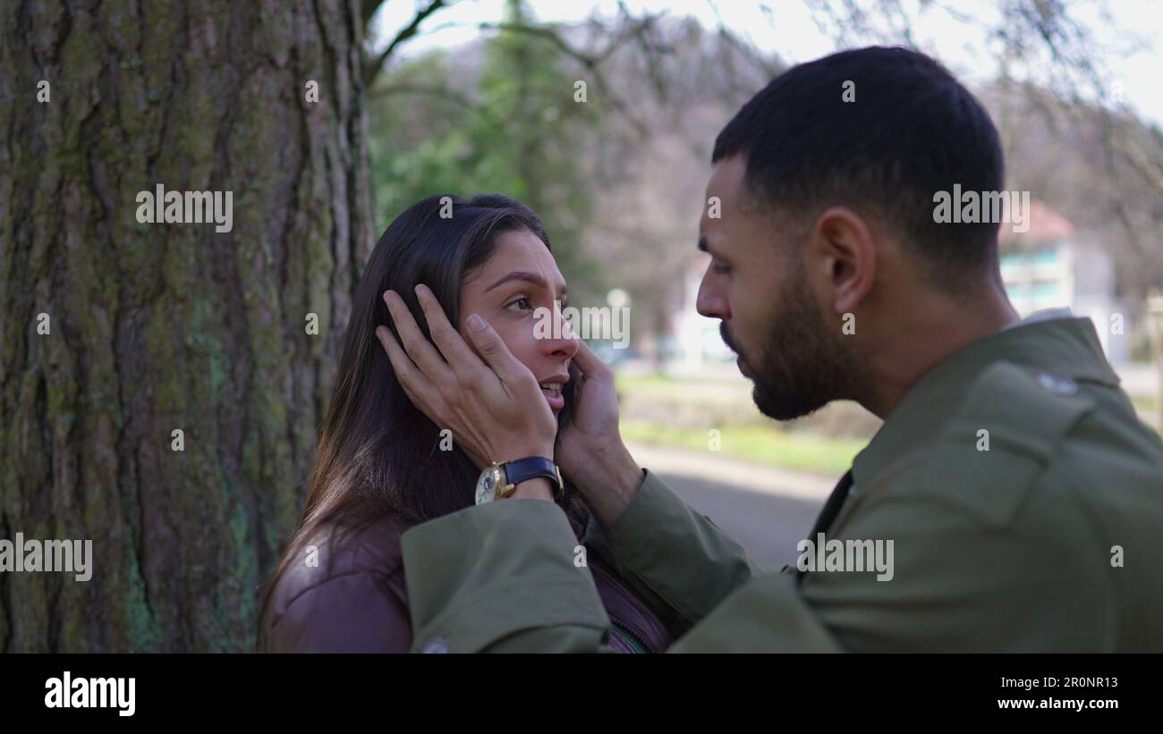 Loving boyfriend providing comfort to his grieving girlfriend during a ...