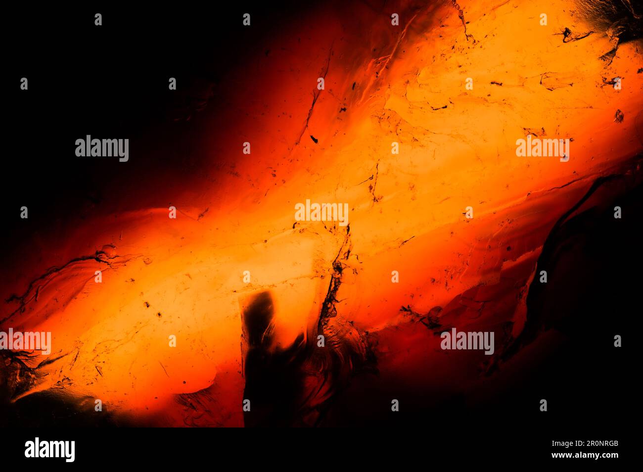 Amber macro detail. Red yellow orange texture background. close-up raw ...