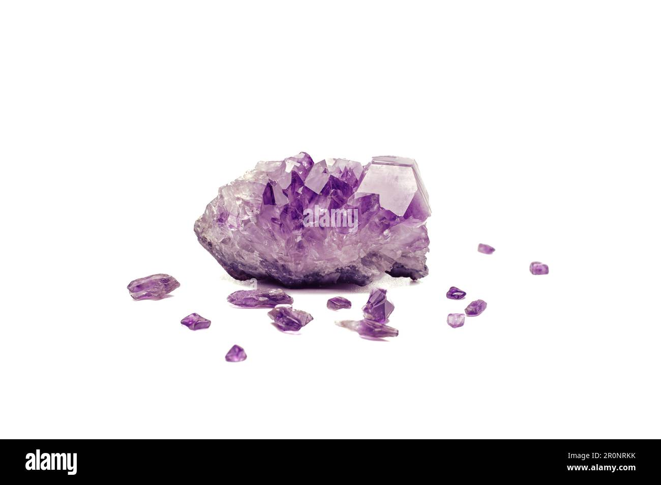 Amethyst macro detail white isolated background. close-up Rough raw ...