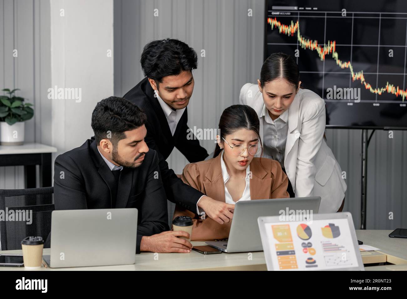 Financial advisors collaborate to assess a company's financial ...