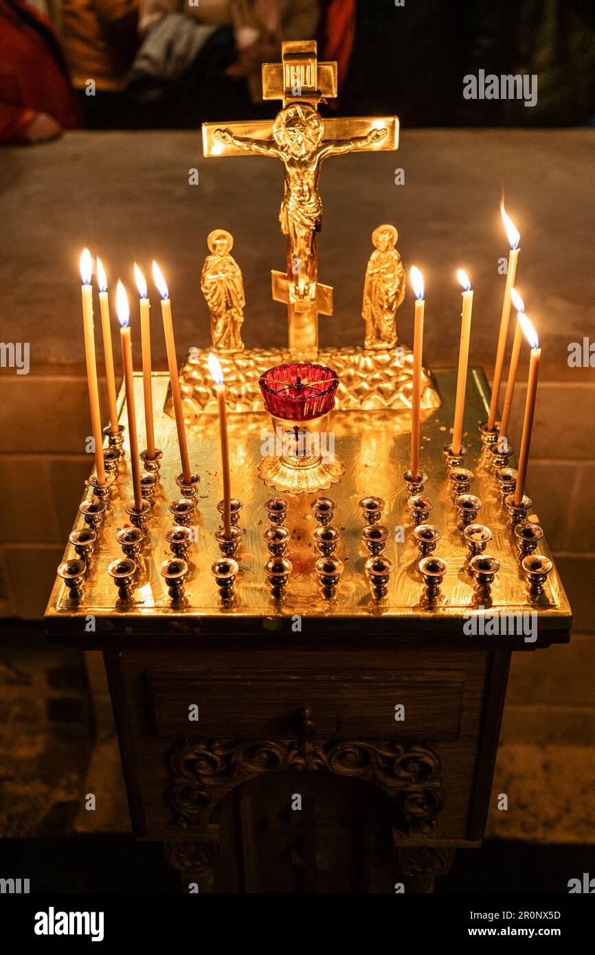 candles burn on funeral memorial table in dark church Stock Photo - Alamy