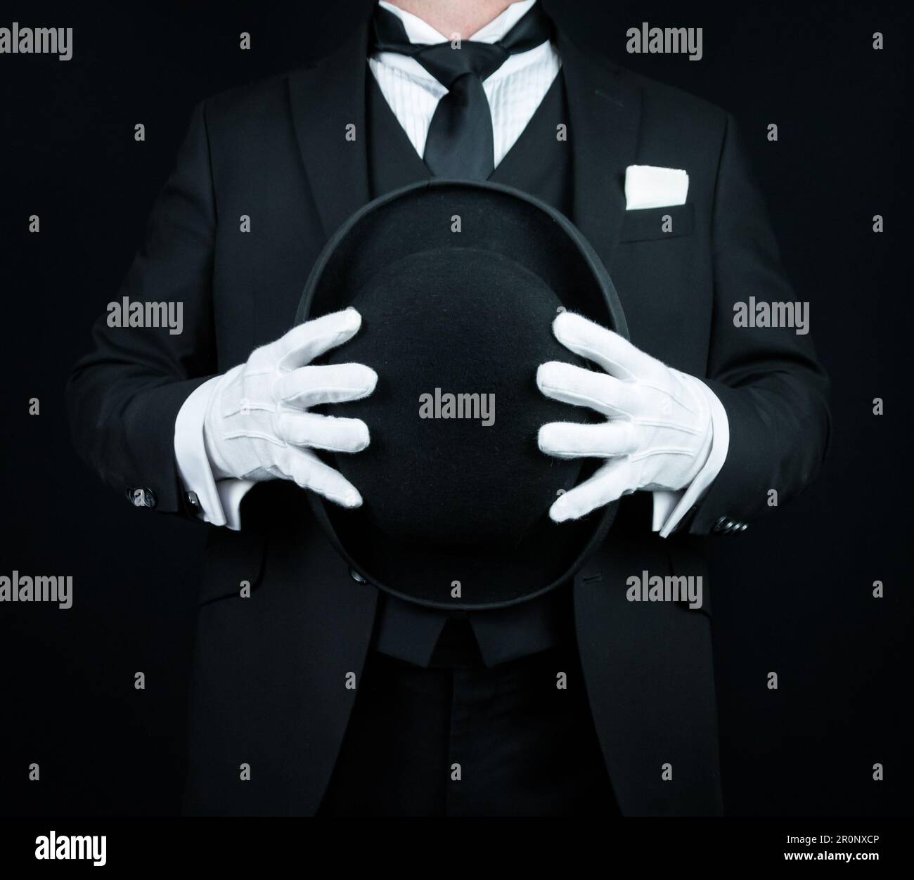 Portrait of Butler in Dark Formal Suit and White Gloves Holding a ...