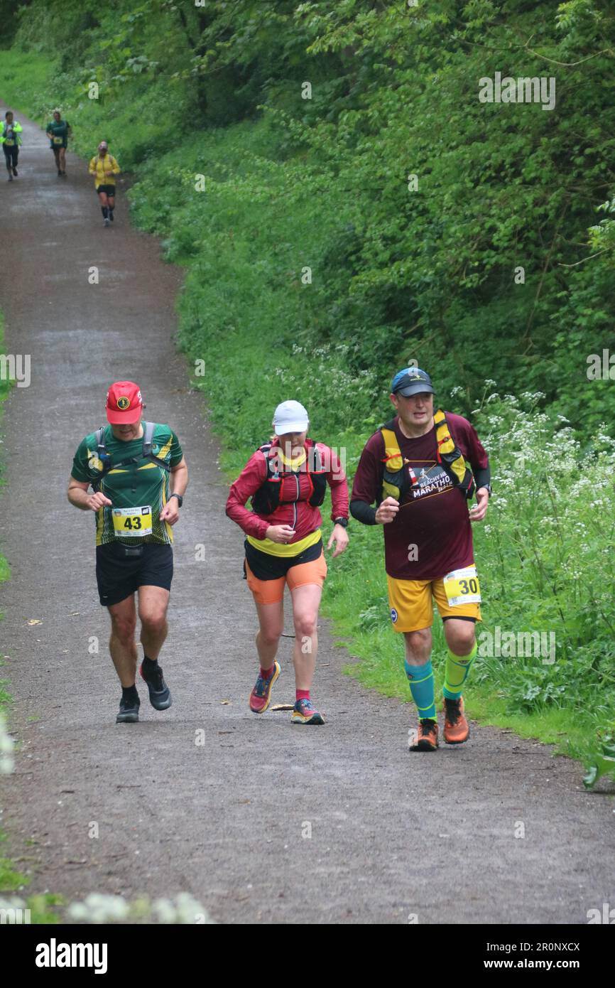 group of runners on a track competing in an Ultra long distance race ...