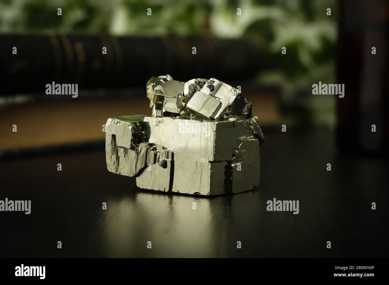 Pyrite cubic crystals on table. macro detail texture background. close ...