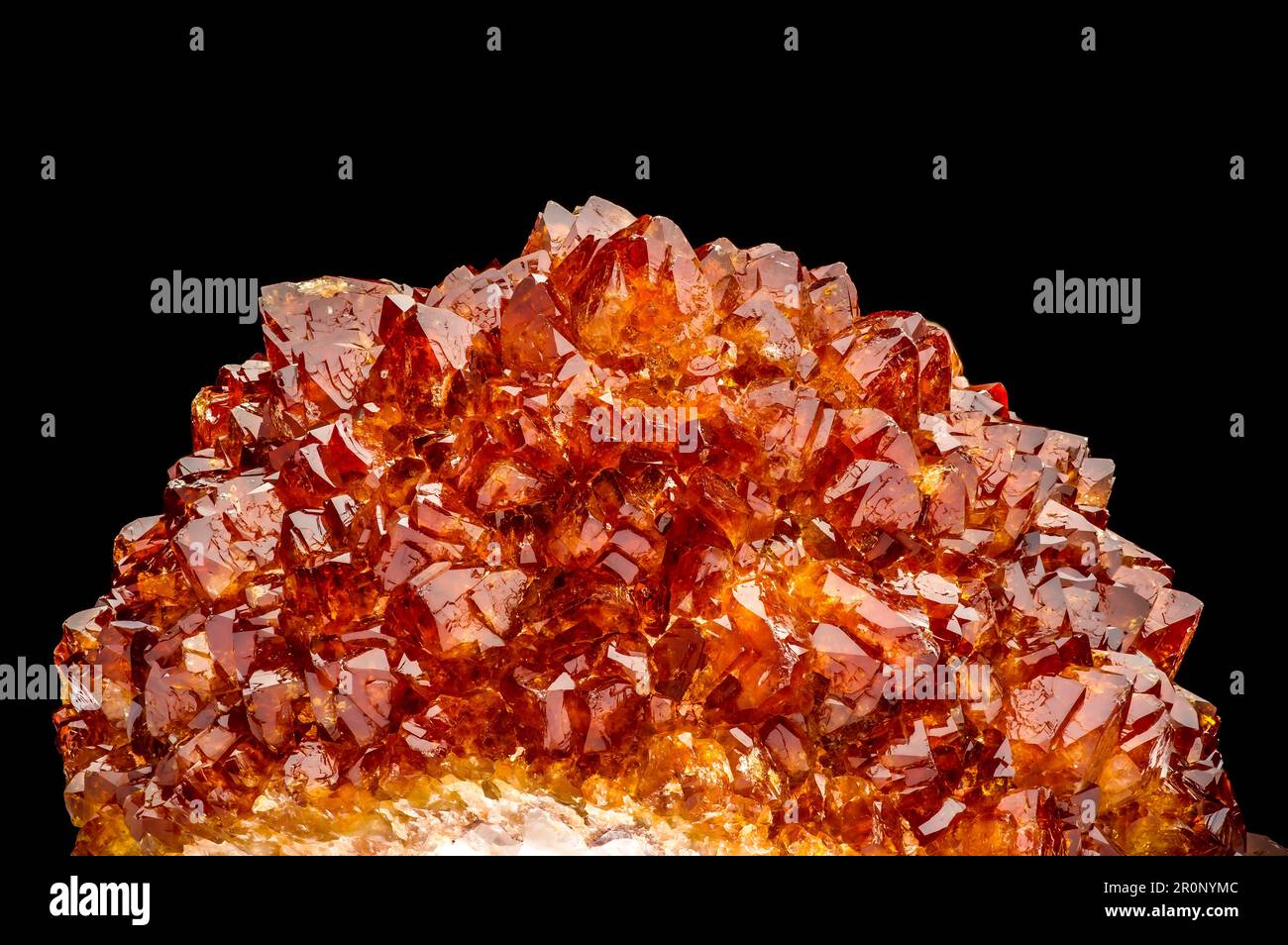 citrine (heated amethyst) druse on black background. macro detail ...