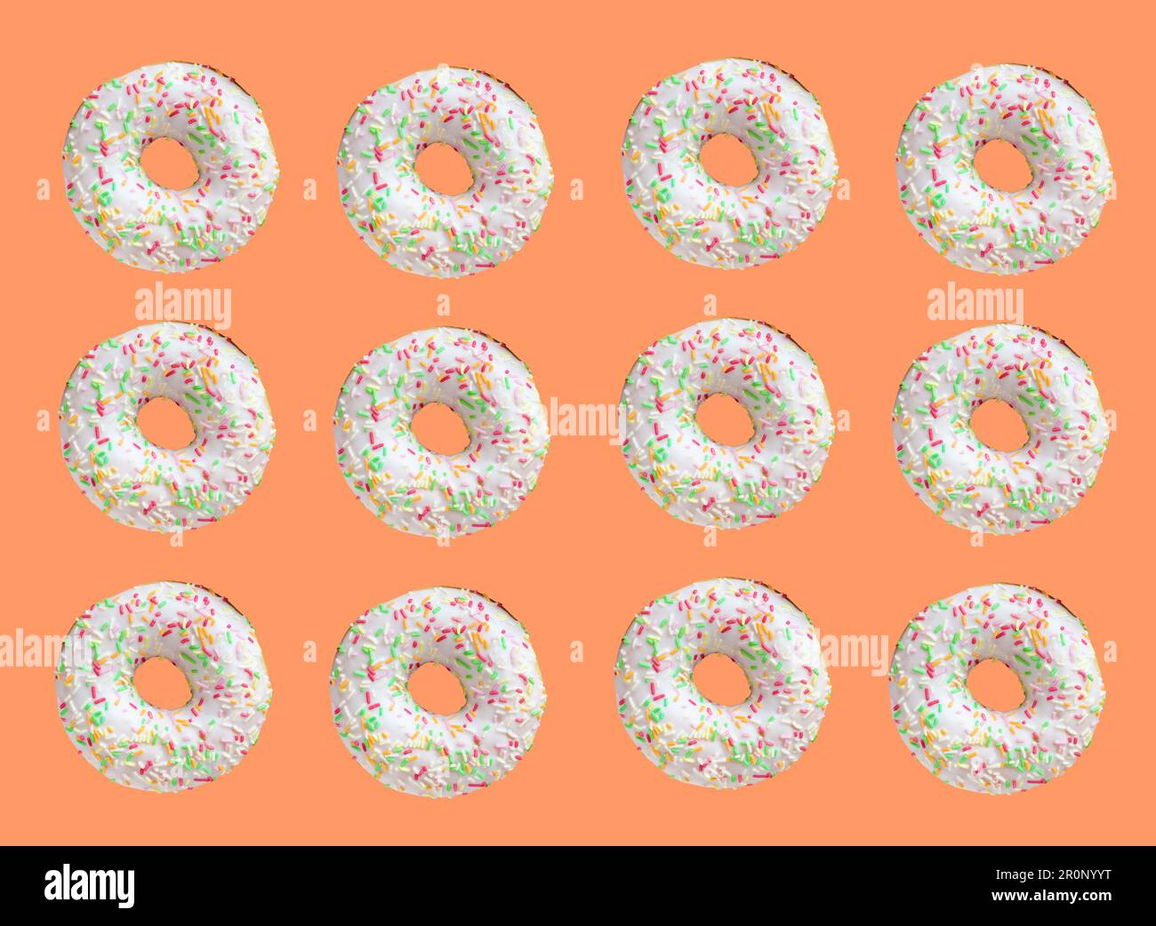 Pattern made of ring donuts with white glaze and clourful hundreds and ...