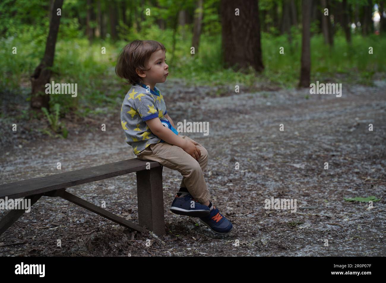 Sad Child Playing Alone