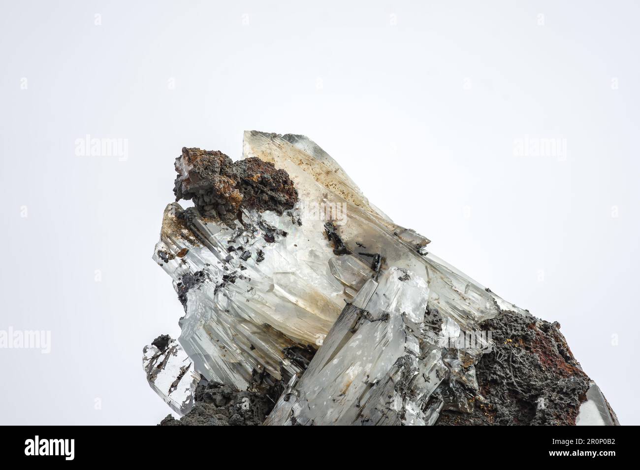 Clear barite crystal on white background. macro detail texture ...