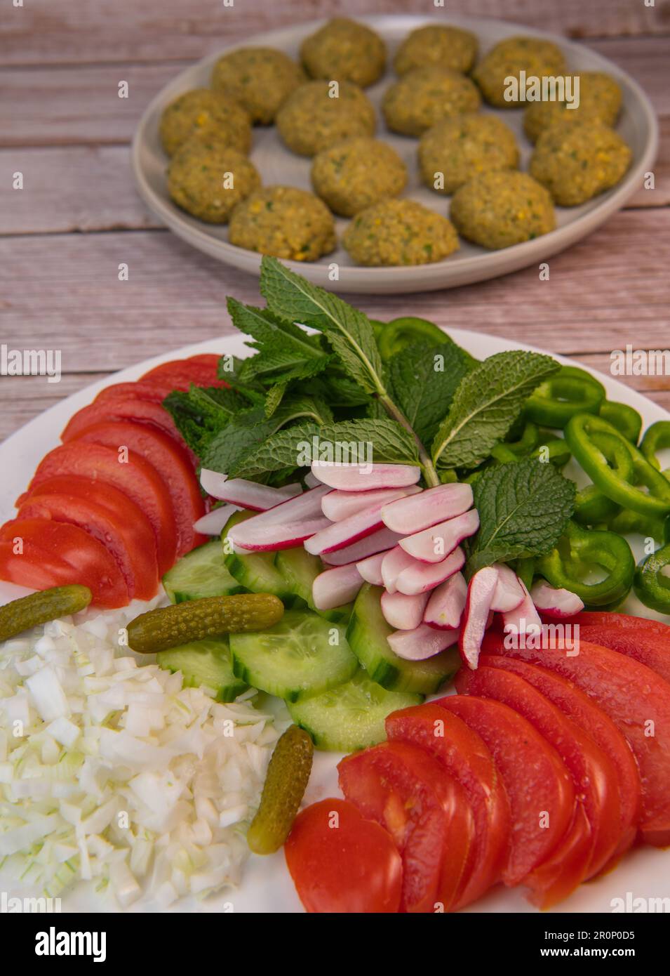 Plate of fresh vegetable salad, tomato, cucumber, onion, gherkin ...