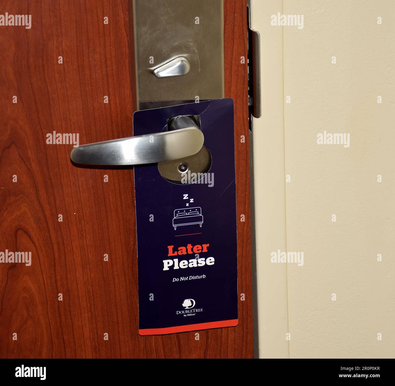A do not disturb placard placed by a hotel customer on the door knob ...