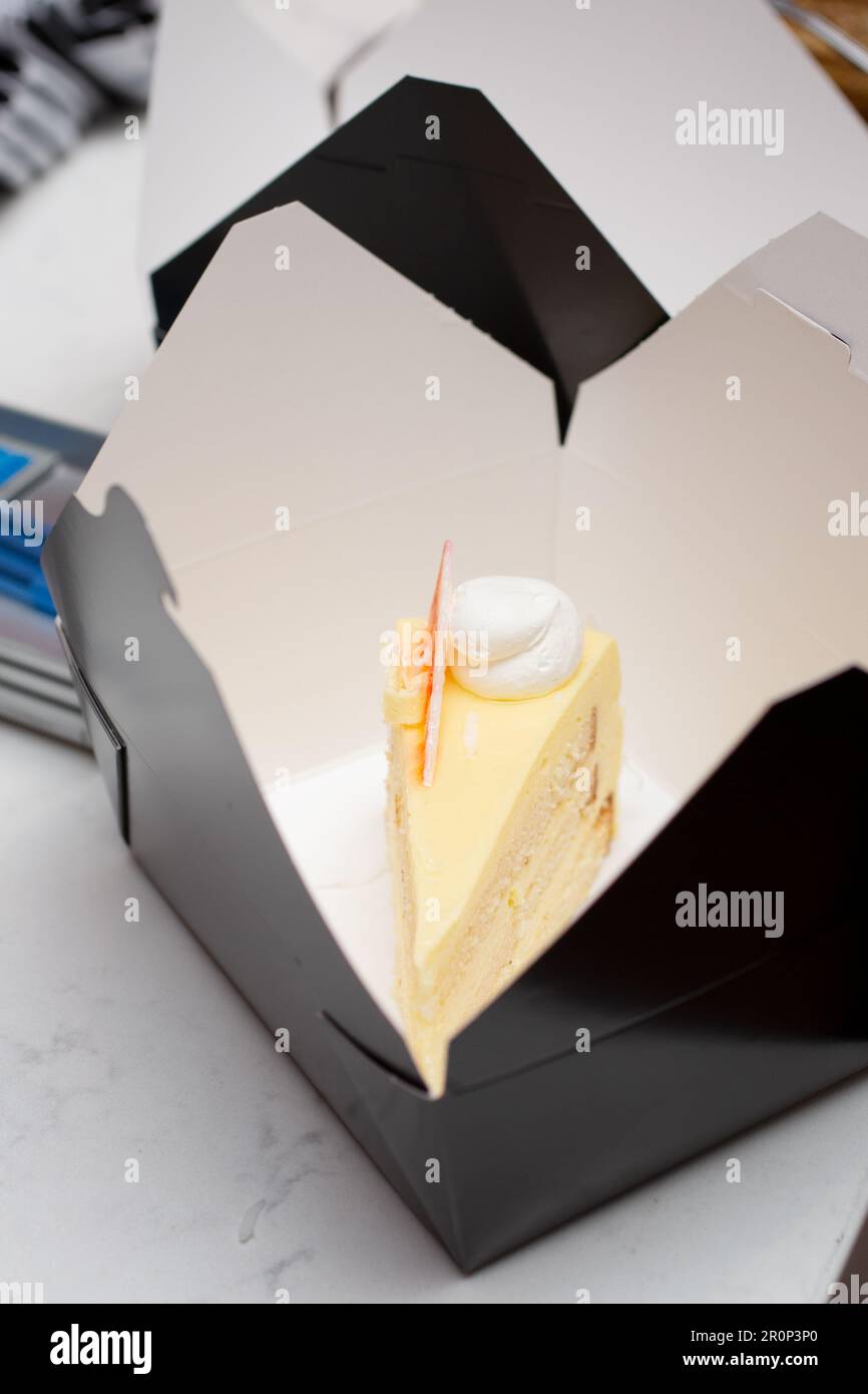 A view of a slice of pie inside a to-go container, in a restaurant ...