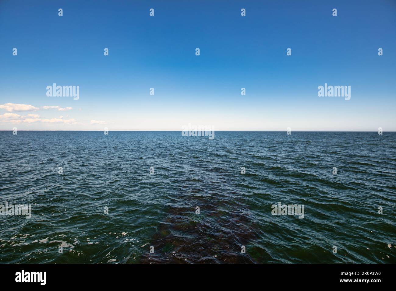 The sea meets the sky in a vibrant display of blue and green in this ...