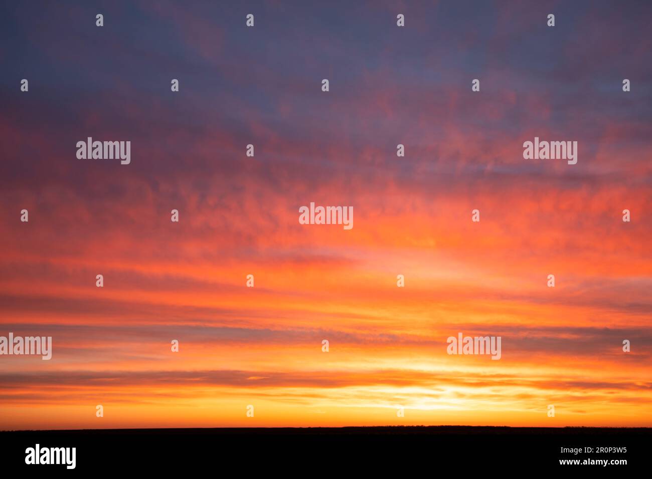 The sky is set ablaze with brilliant colors in this stunning photo. The ...