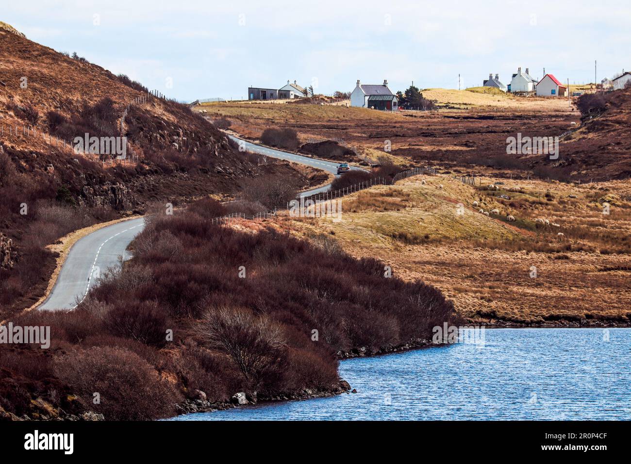 A scenic winding road surrounded by majestic rolling hills and tranquil ...