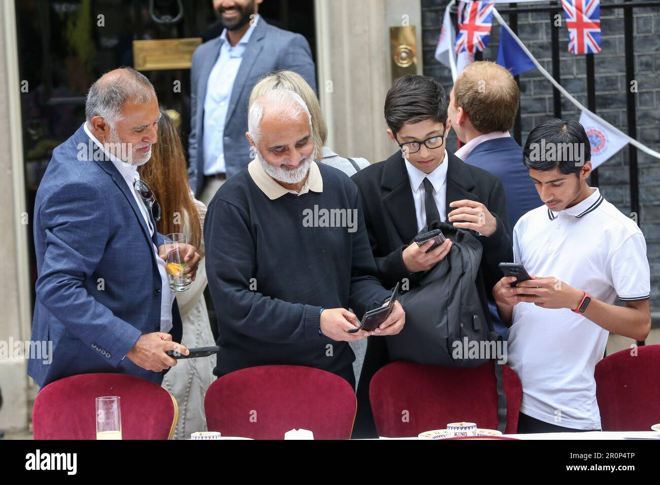 London, UK. 7th May, 2023. Guests take photographs of the table ...