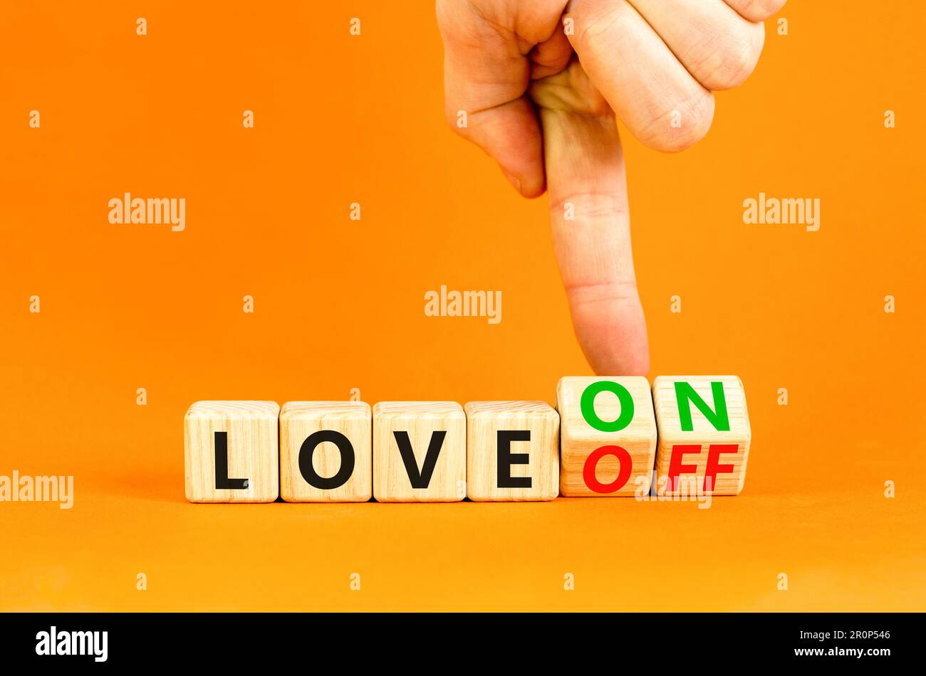 Love on or off symbol. Businessman turns wooden cubes and changes word ...
