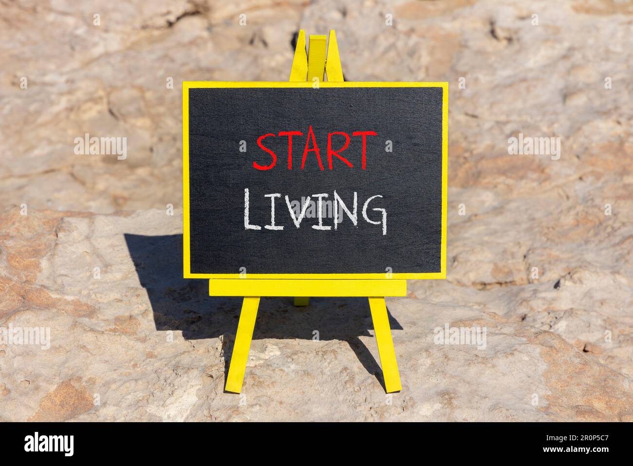 Start living symbol. Concept words Start living on beautiful black ...