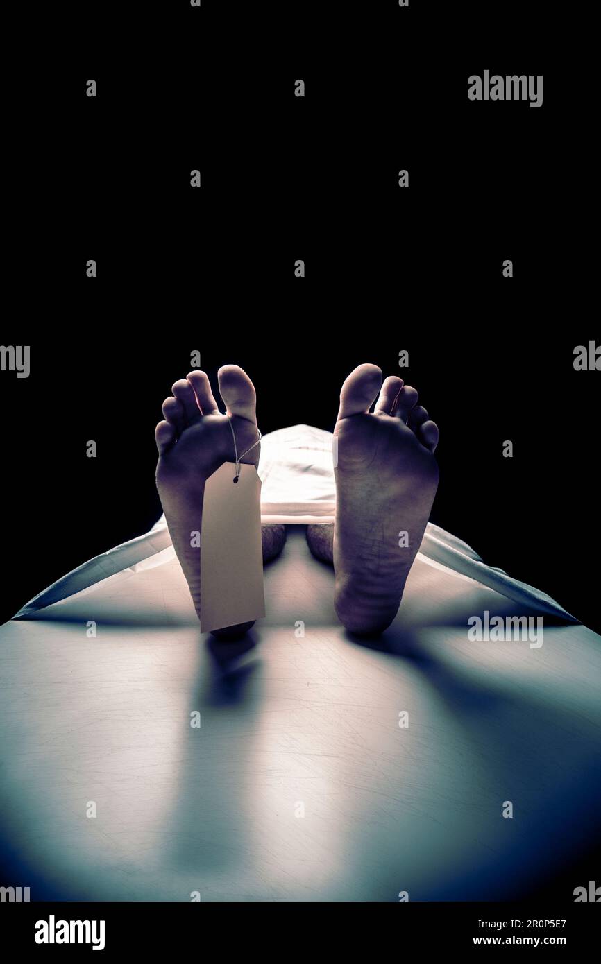 close-up of a dead man's feet on the mortuary table background Stock ...