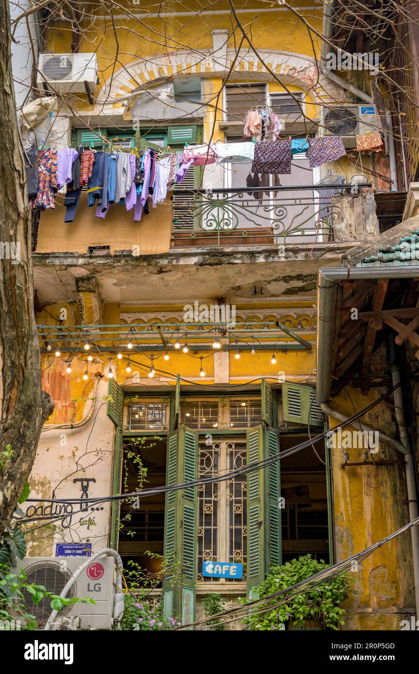 Washed clothes hanging out to dry outside the balcony of a town house ...