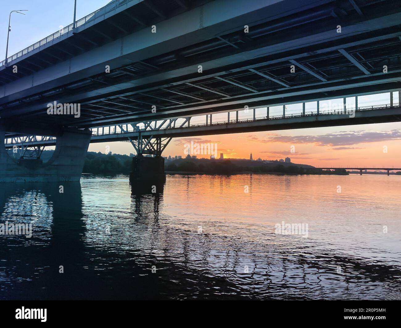 New Darnytskyi Bridge across Dnipro river in Kyiv, Ukraine on sunset ...