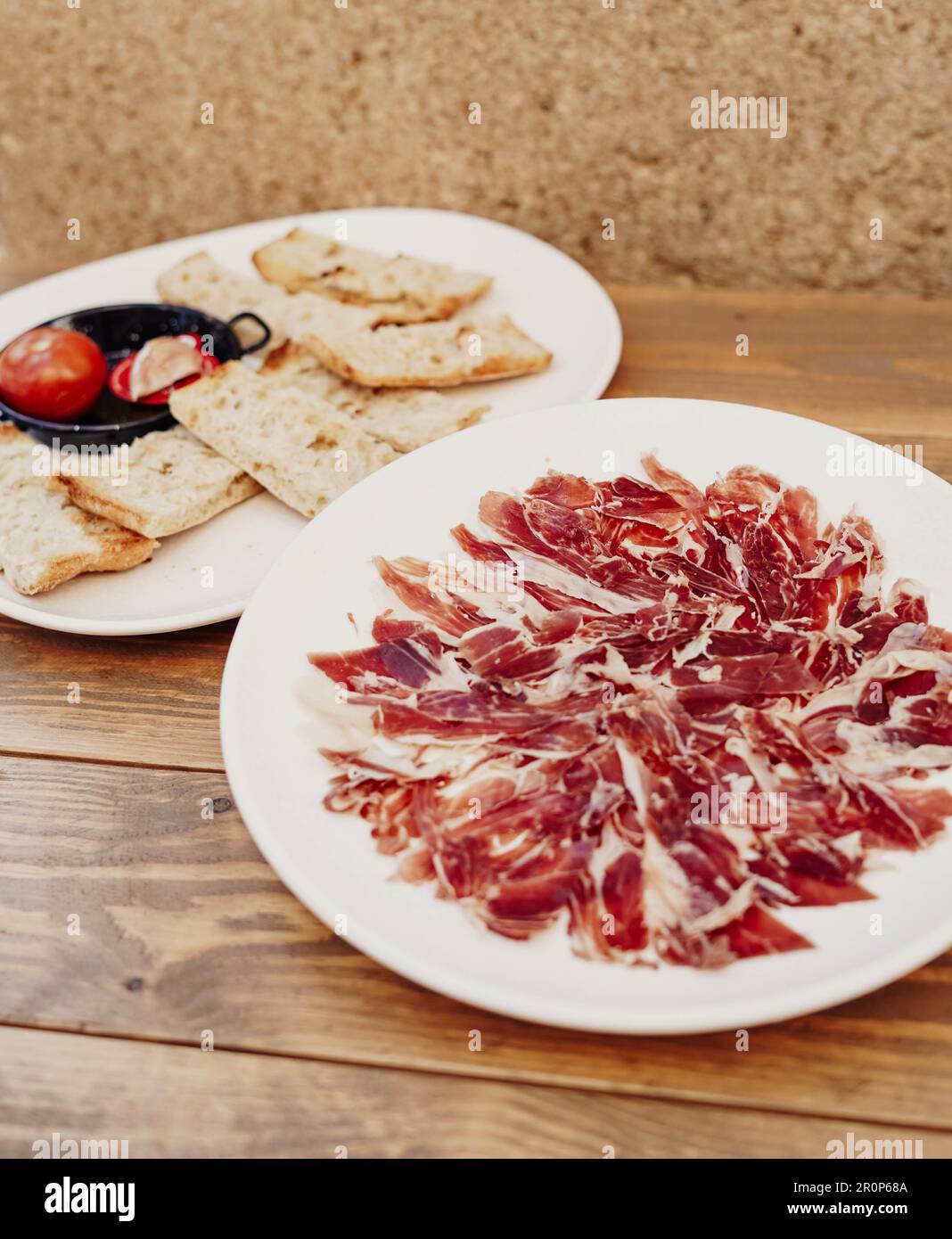 Iberian ham, also known as Jamón Ibérico, is a type of cured ham that ...