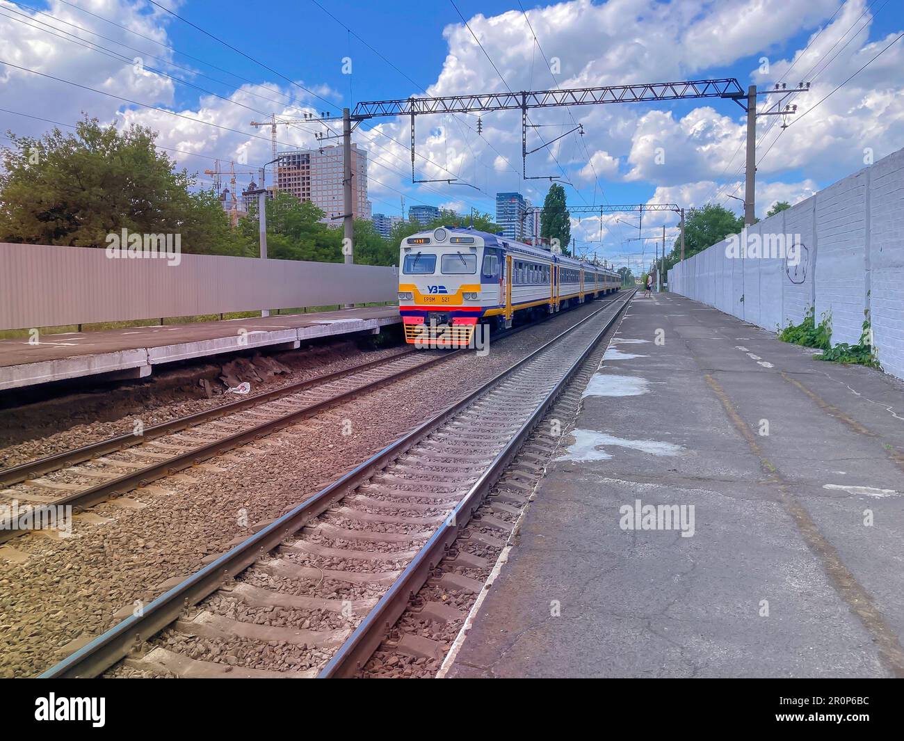 Arrival of an electric train. A modern city train arrives at the ...