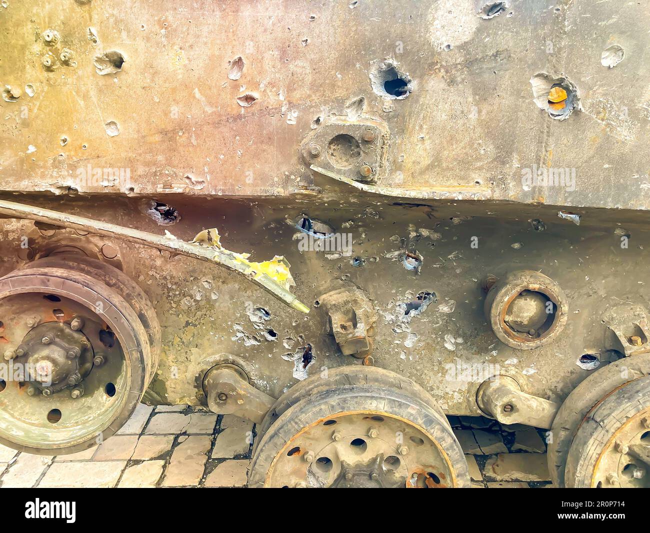 Shelled and pierced armor on a combat vehicle. Shrapnel-pierced armor ...
