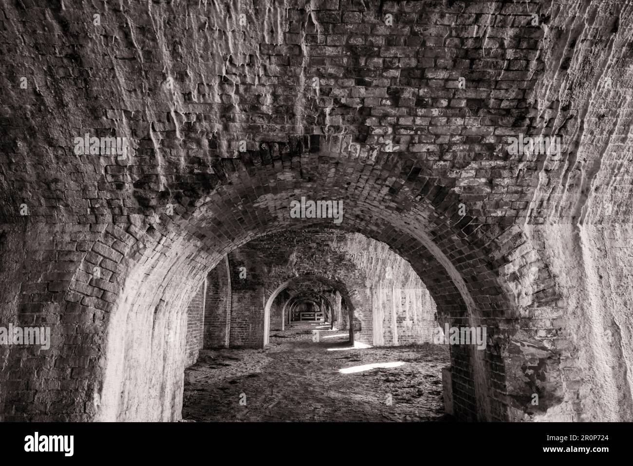 Limestone leaks onto the multiple brick arches in historic Fort Pickens ...