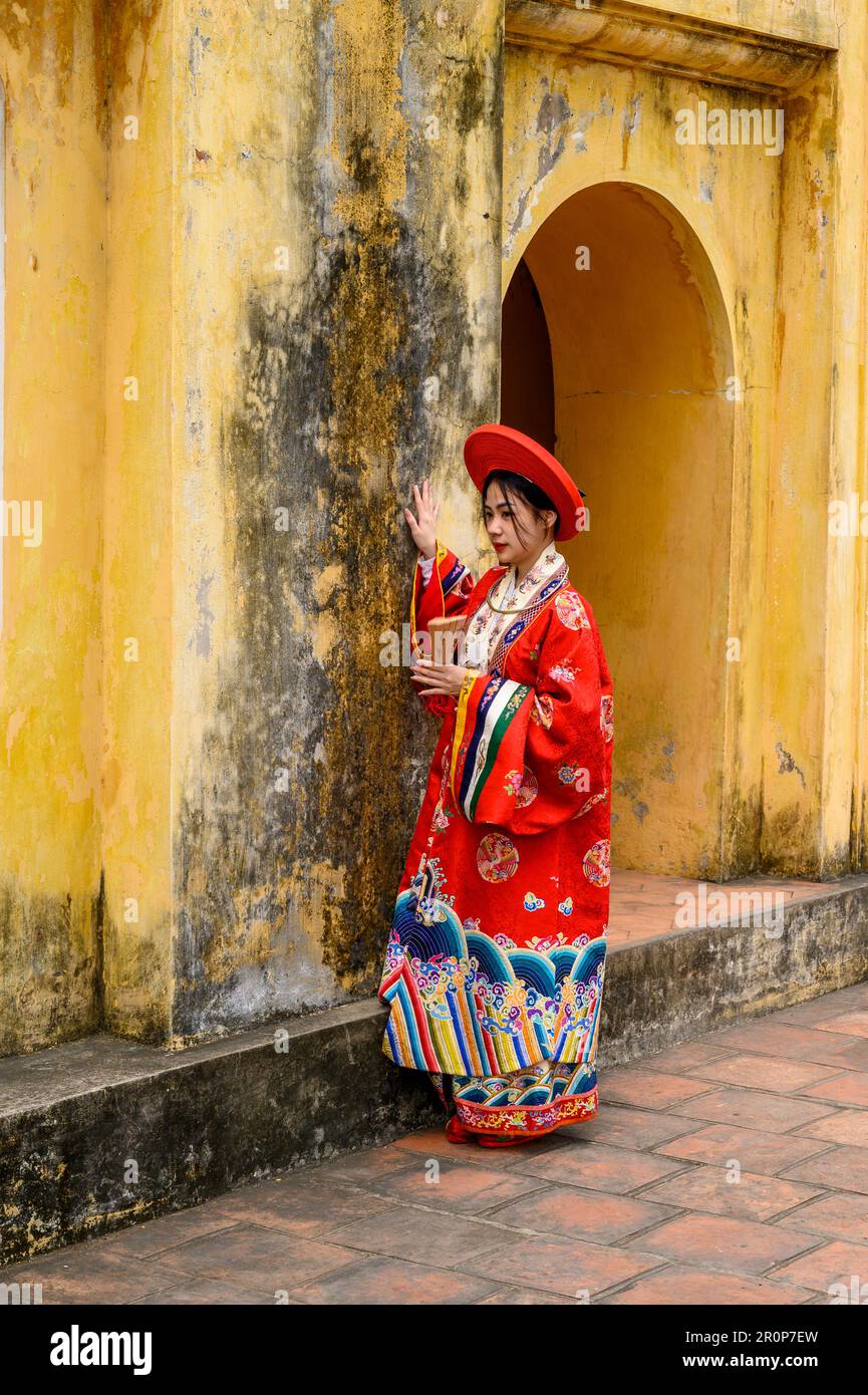 A girl posing for the camera in traditional costume inside the Imperial ...