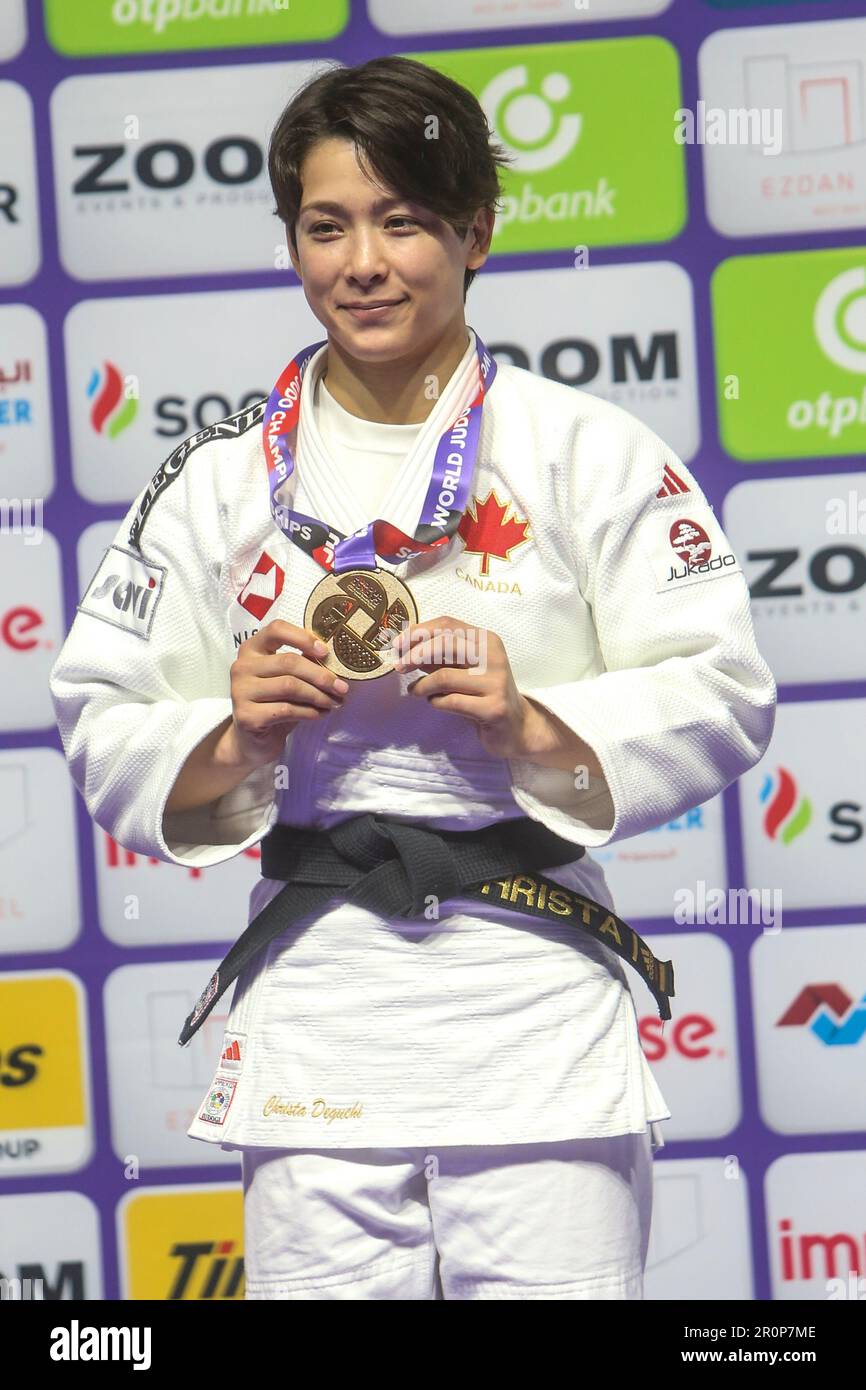Gold medalist Christa Deguchi of Canada poses during the medal ceremony ...