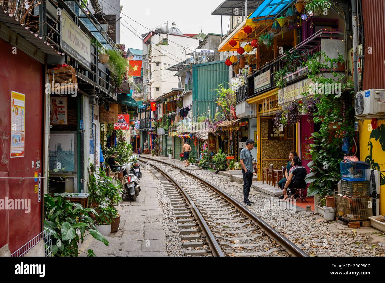 The Train Street with tracks flanked by cafés and restaurants in ...