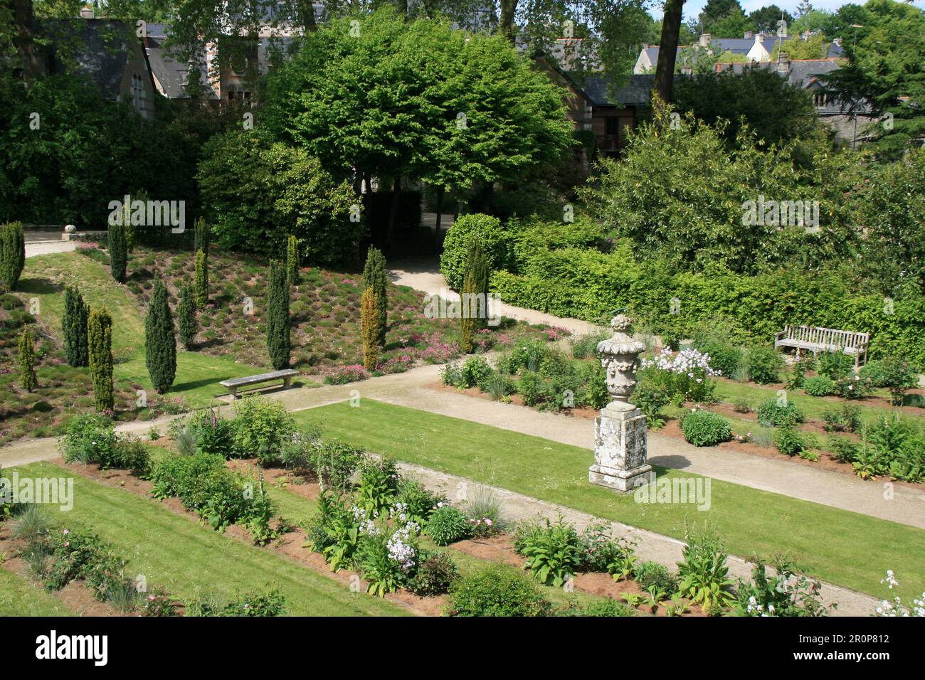 the french-style garden of a medieval castle in josselin in brittany ...