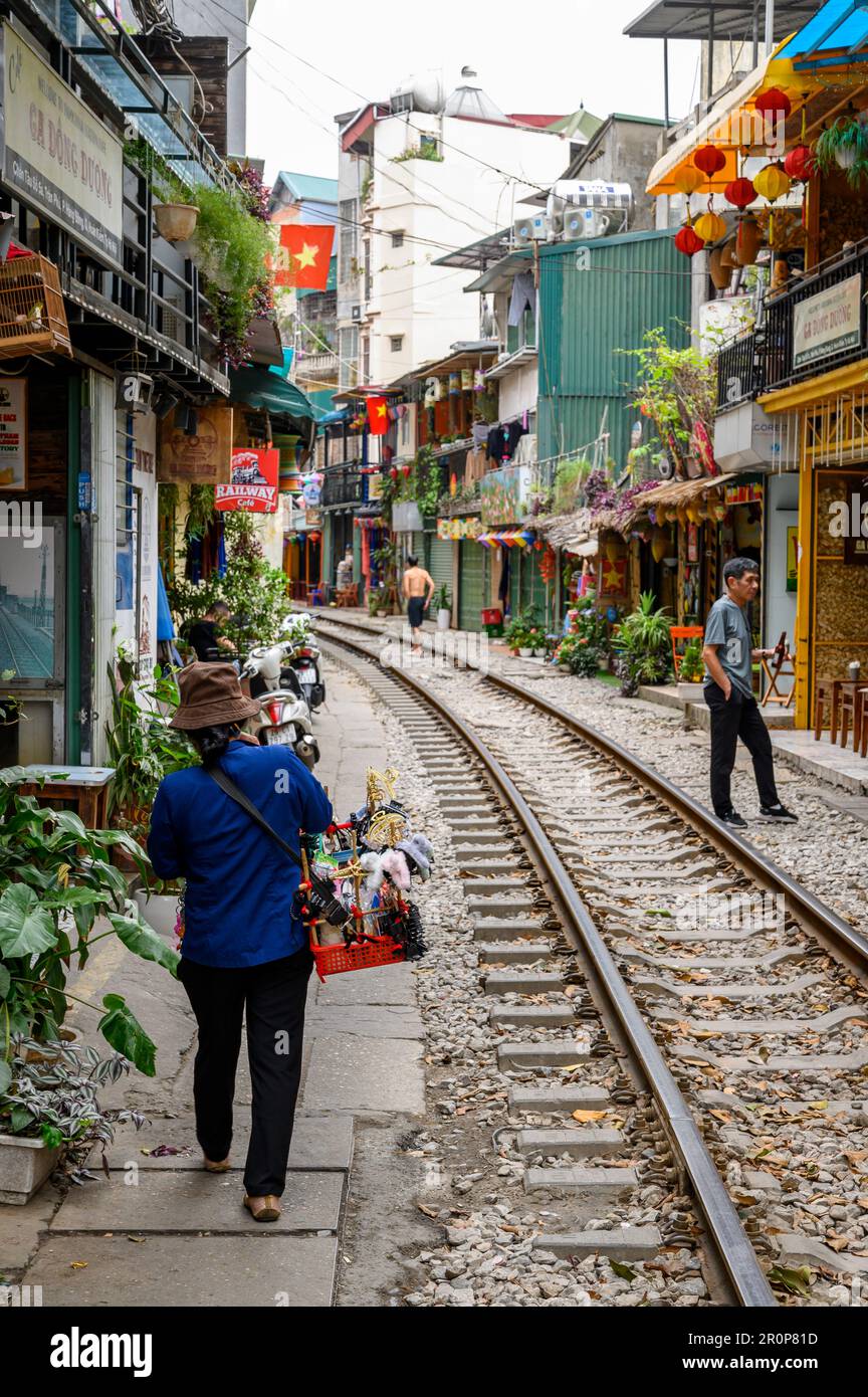 The Train Street with tracks flanked by cafés and restaurants in ...