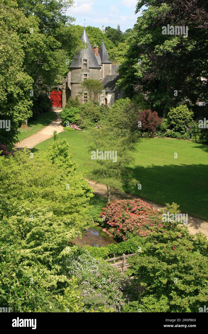 the french-style garden of a medieval castle in josselin in brittany ...