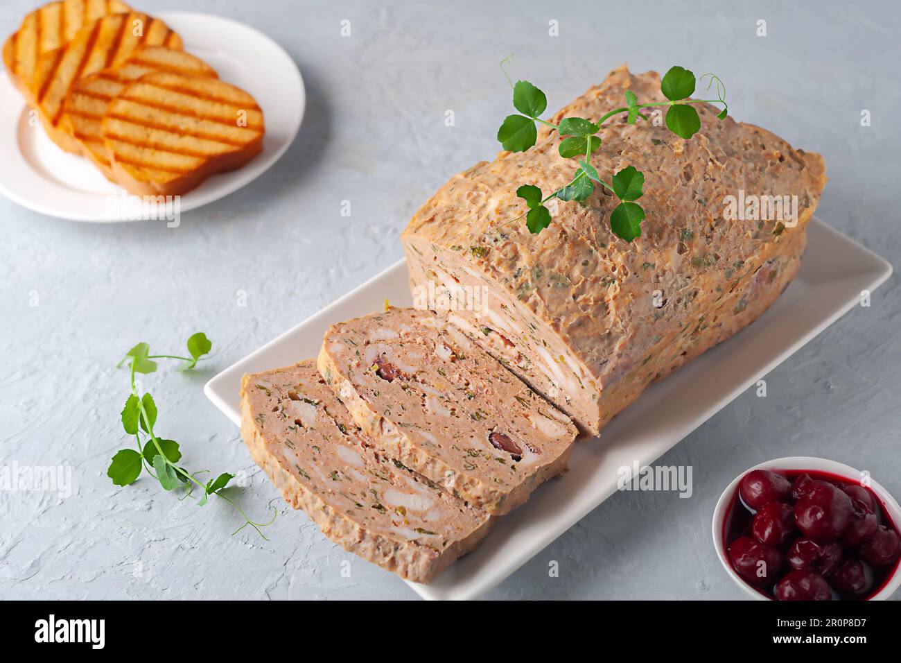 Chicken terrine. Chicken meat pate with fresh parsley Stock Photo - Alamy