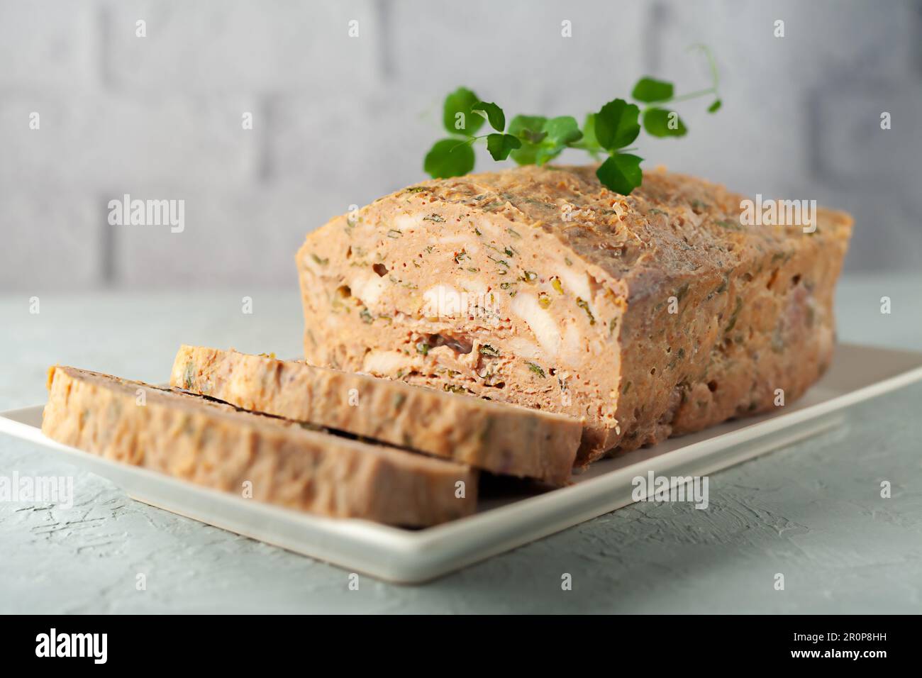 Chicken terrine. Chicken meat pate with fresh parsley Stock Photo - Alamy