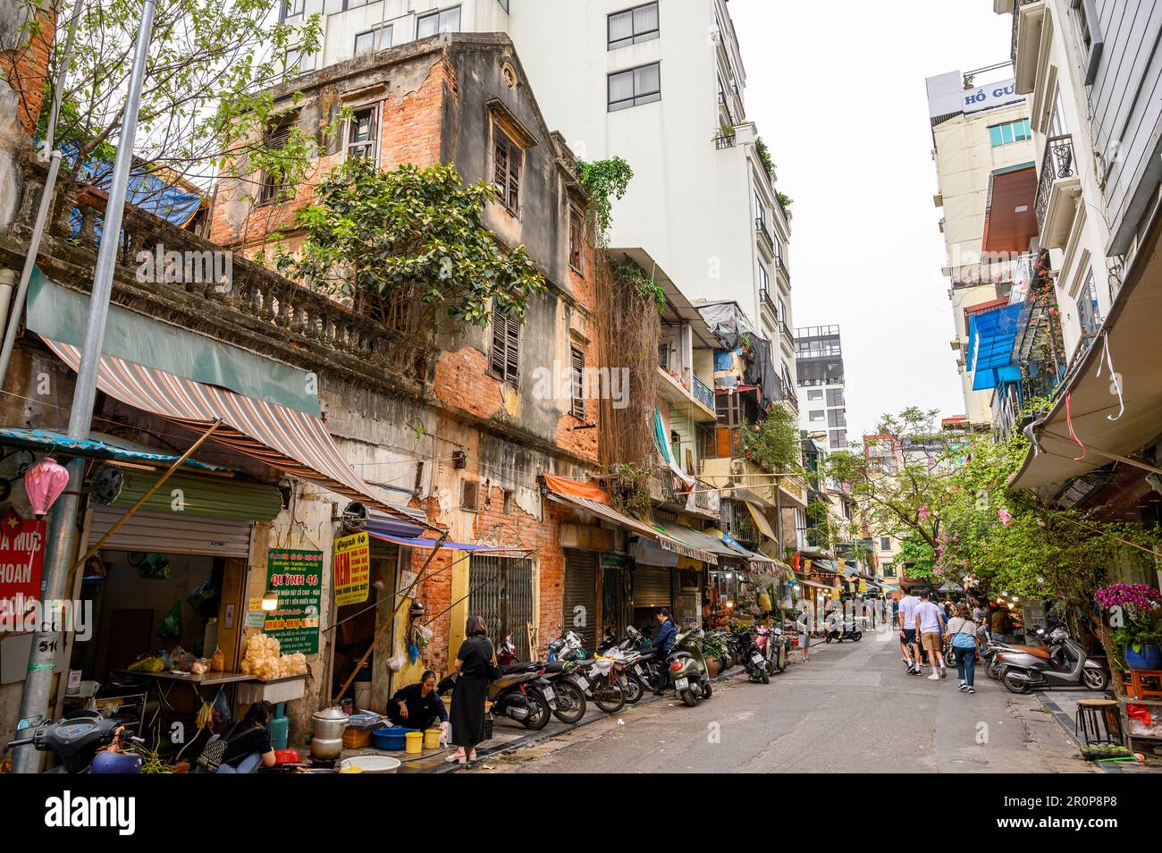 A typical street scene in downtown Hanoi with a random collection of ...